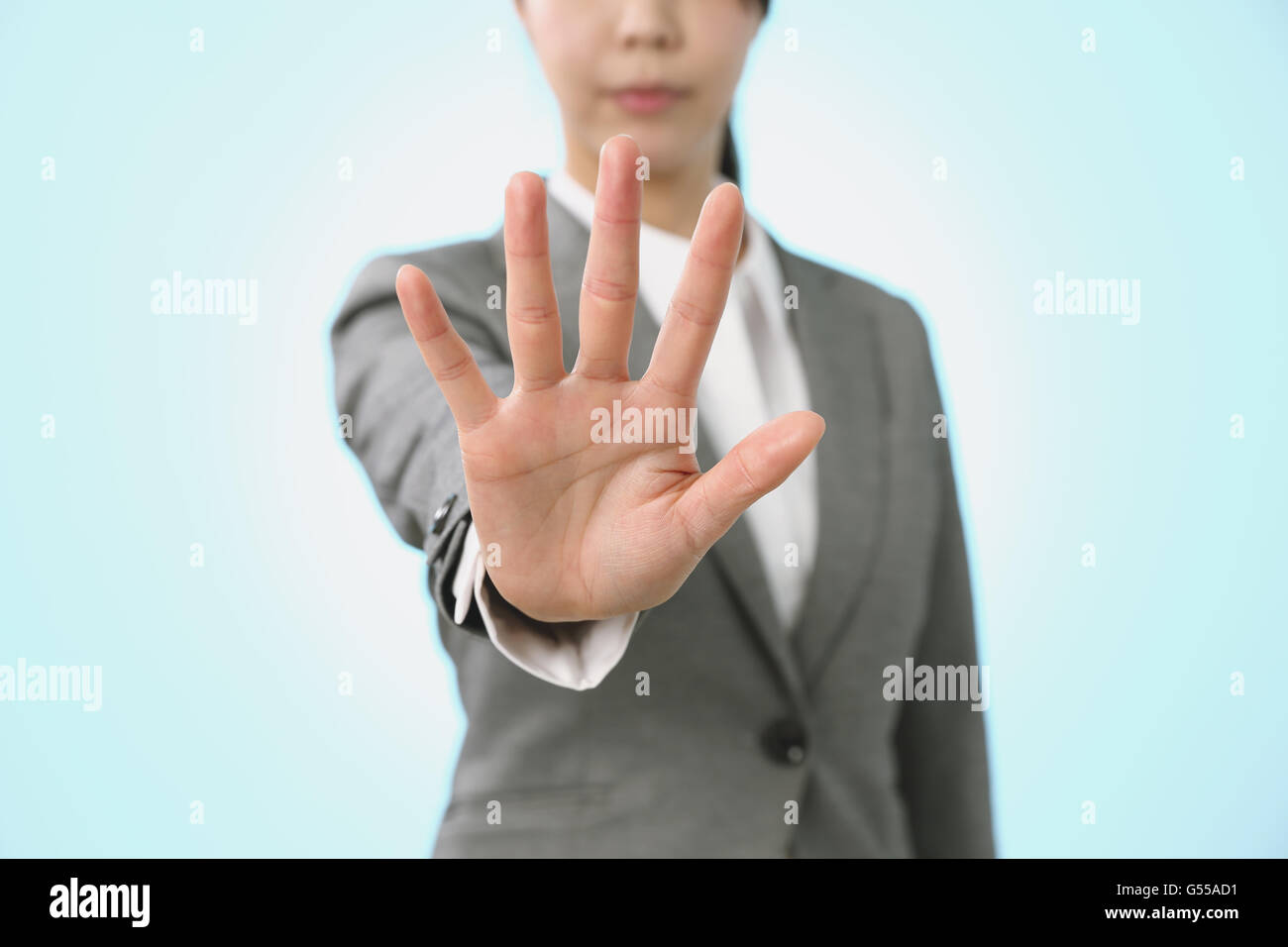 Japanese woman performing touch gesture Stock Photo - Alamy