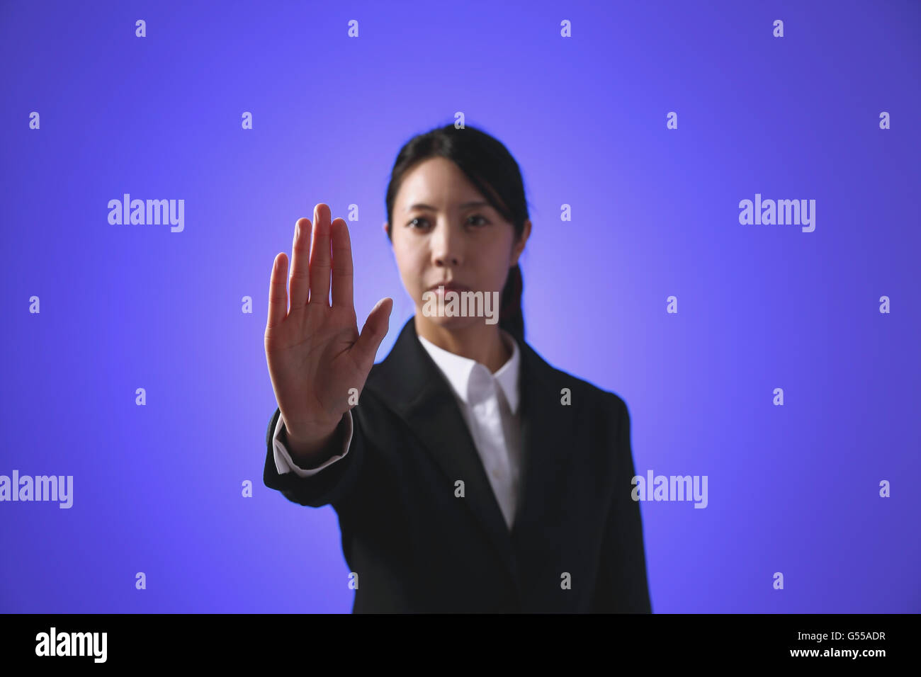 Japanese woman performing touch gesture Stock Photo - Alamy