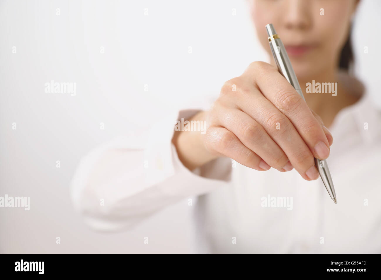 Japanese woman with pen Stock Photo - Alamy