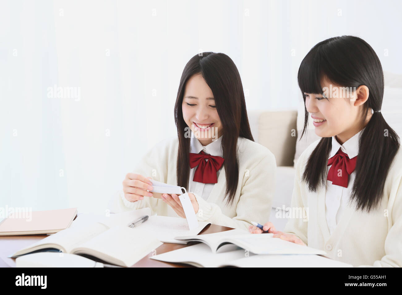 Japanese High-school students in uniform studying together Stock Photo ...