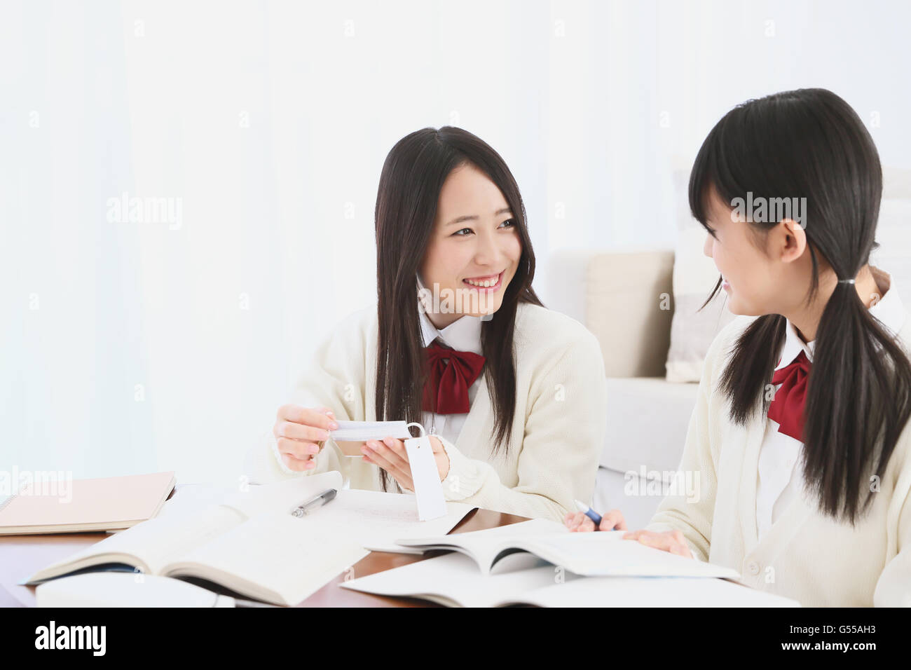 Japanese High-school students in uniform studying together Stock Photo ...