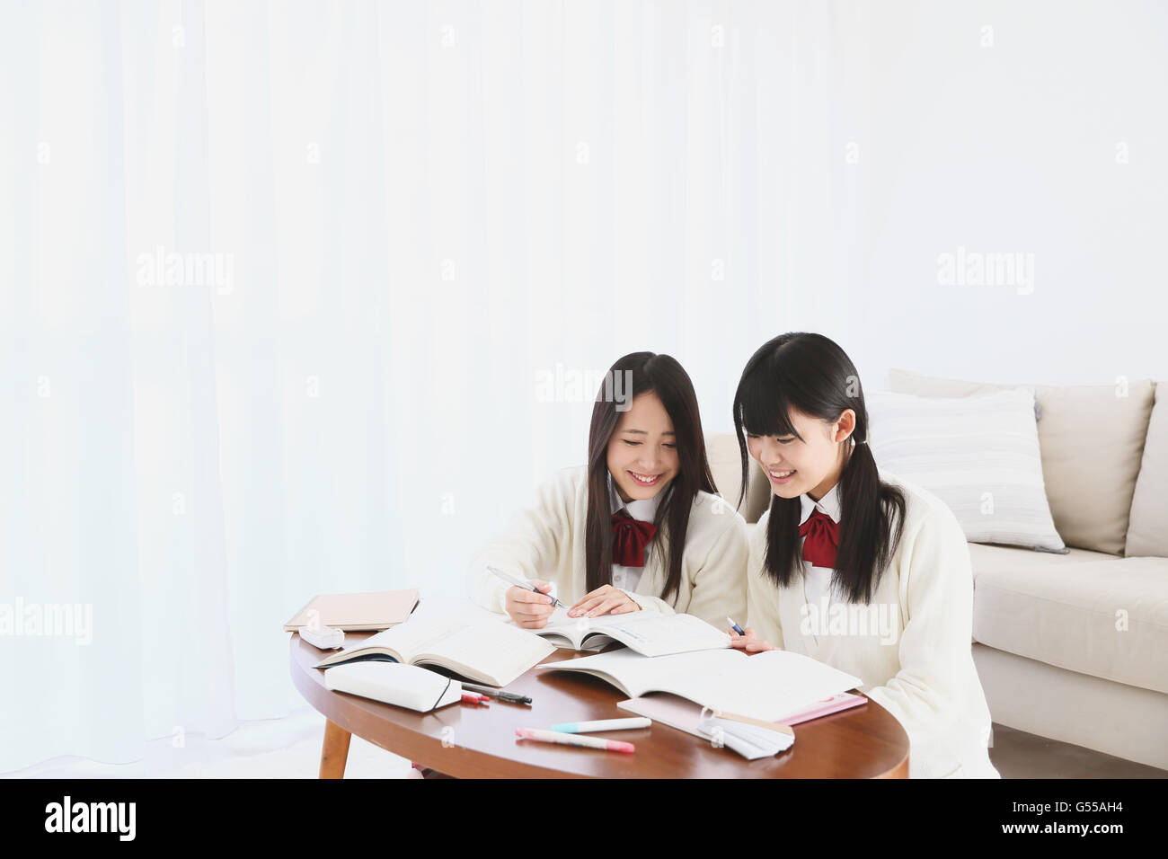 Japanese High-school students in uniform studying together Stock Photo ...