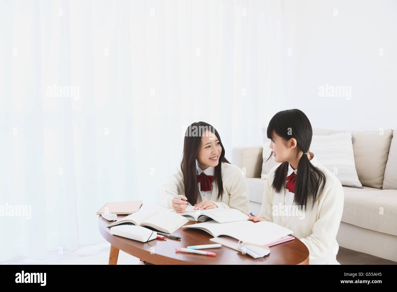 Japanese High-school students in uniform studying together Stock Photo ...