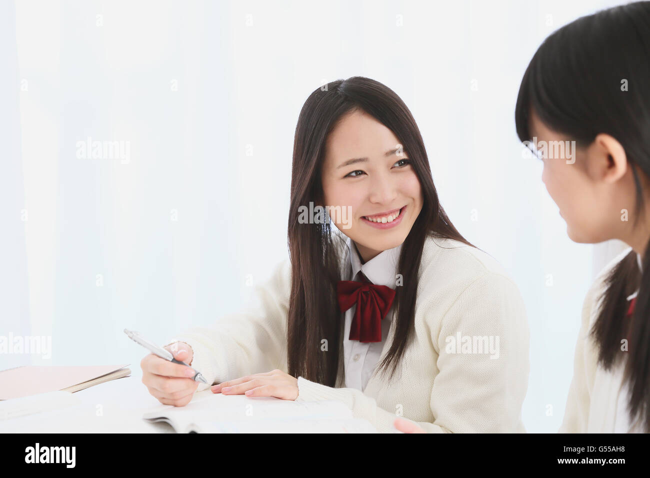 Japanese High-school students in uniform studying together Stock Photo ...