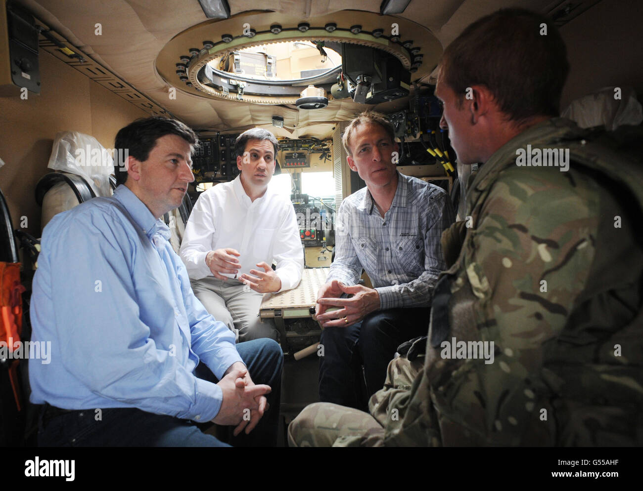 Labour leader Ed Miliband (centre) sits inside a Mastiff armoured ...