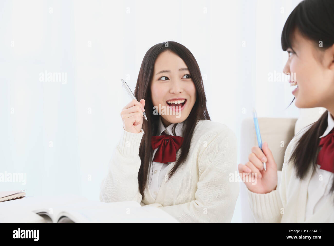 Japanese High-school students in uniform studying together Stock Photo ...