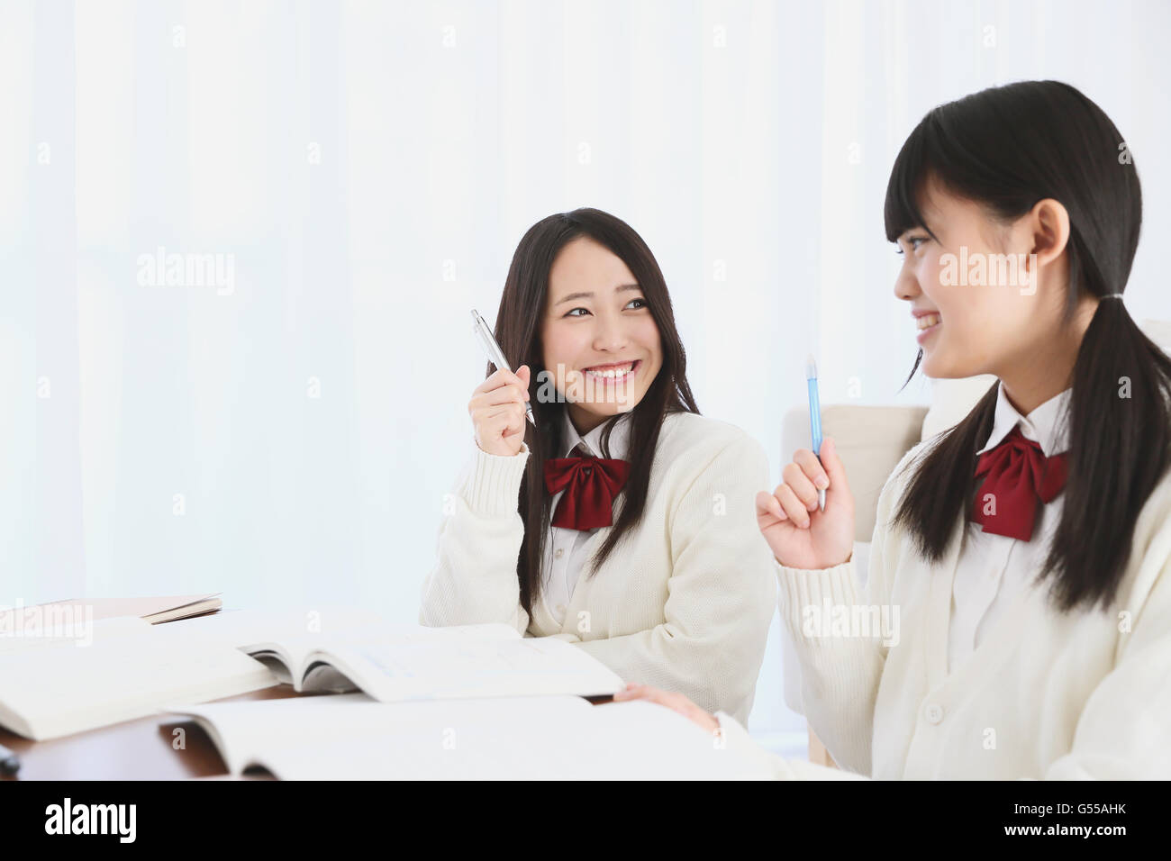 Japanese High-school students in uniform studying together Stock Photo ...