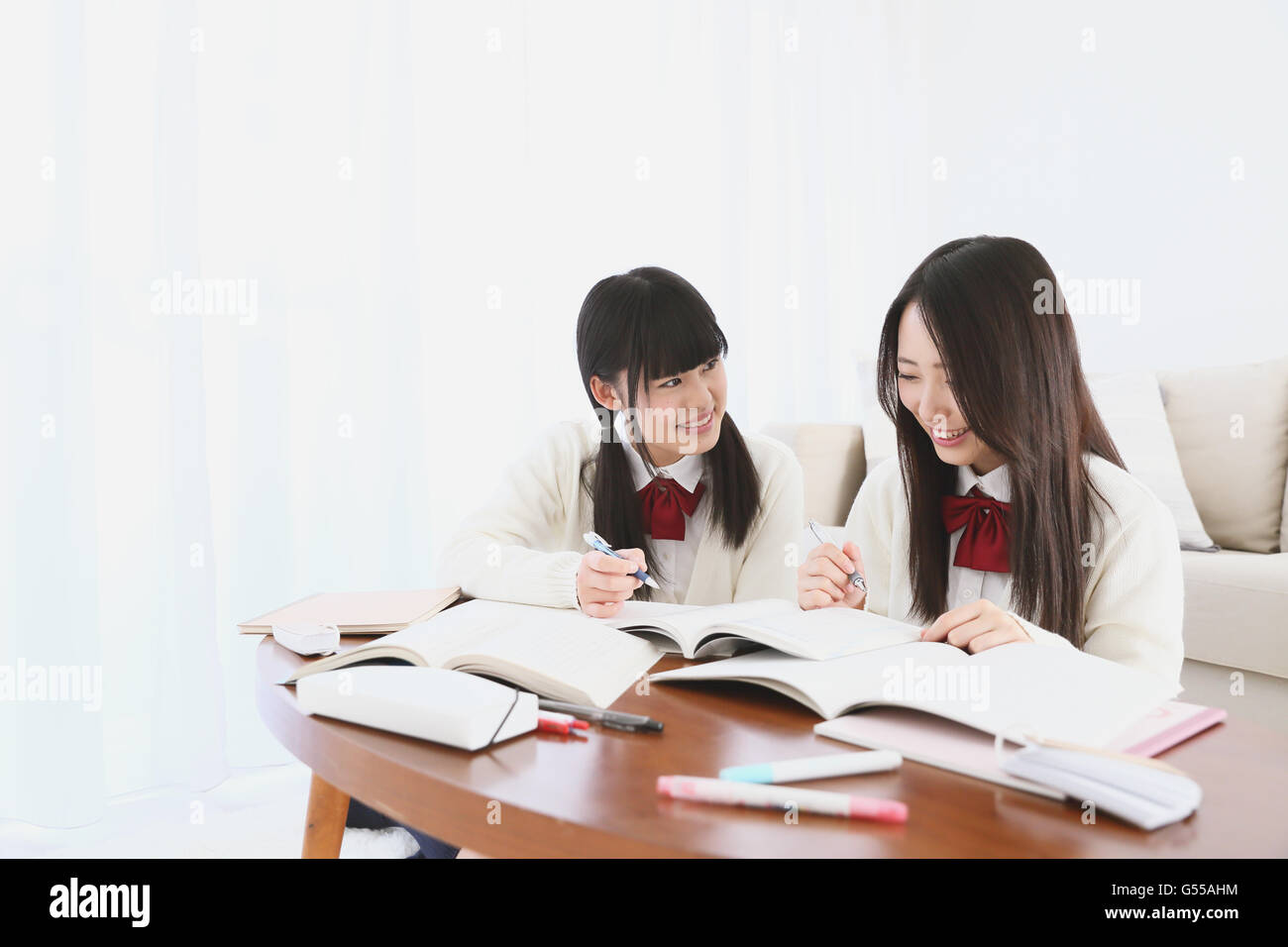 Japanese High-school students in uniform studying together Stock Photo ...