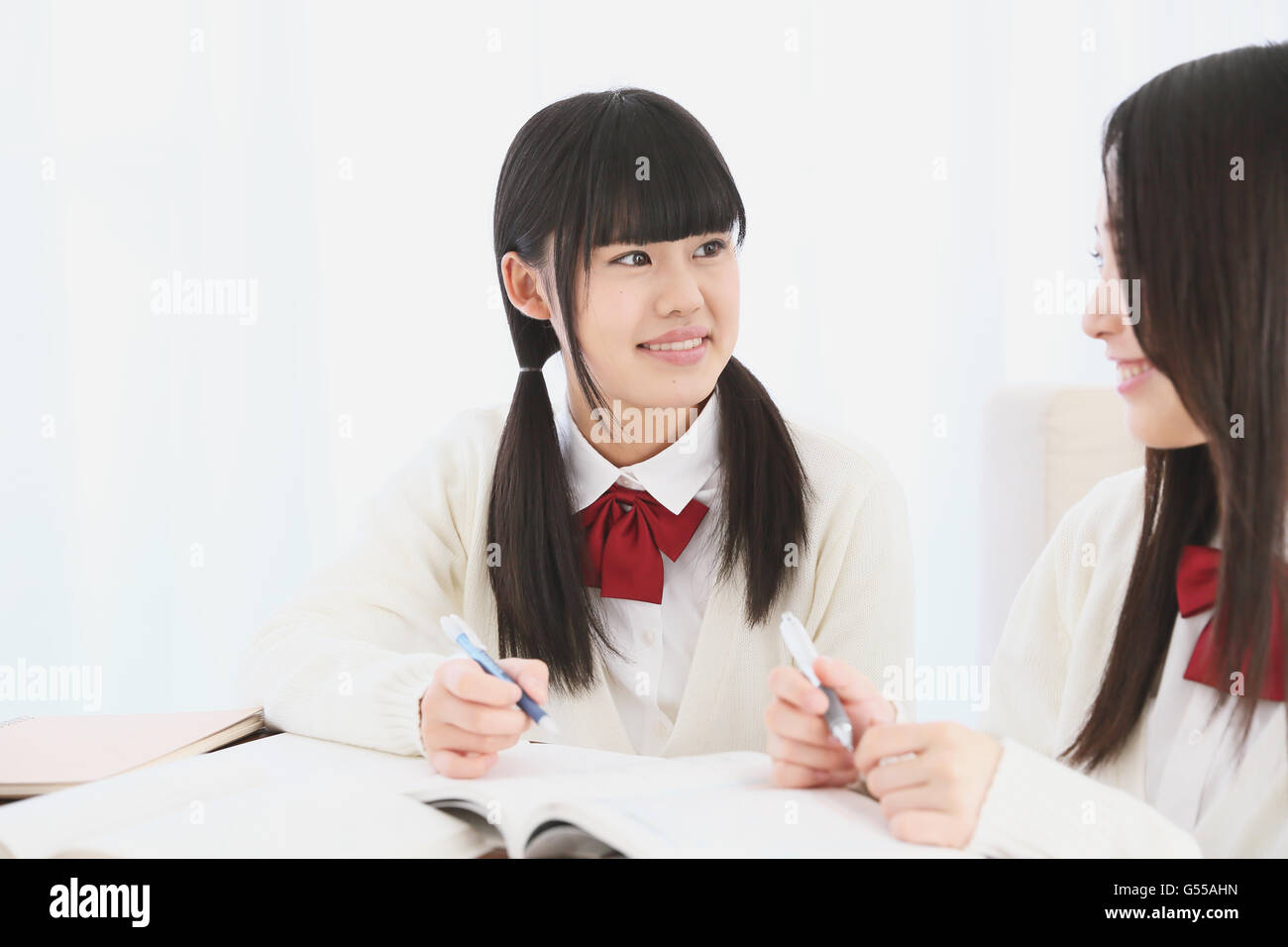 Japanese High-school students in uniform studying together Stock Photo ...