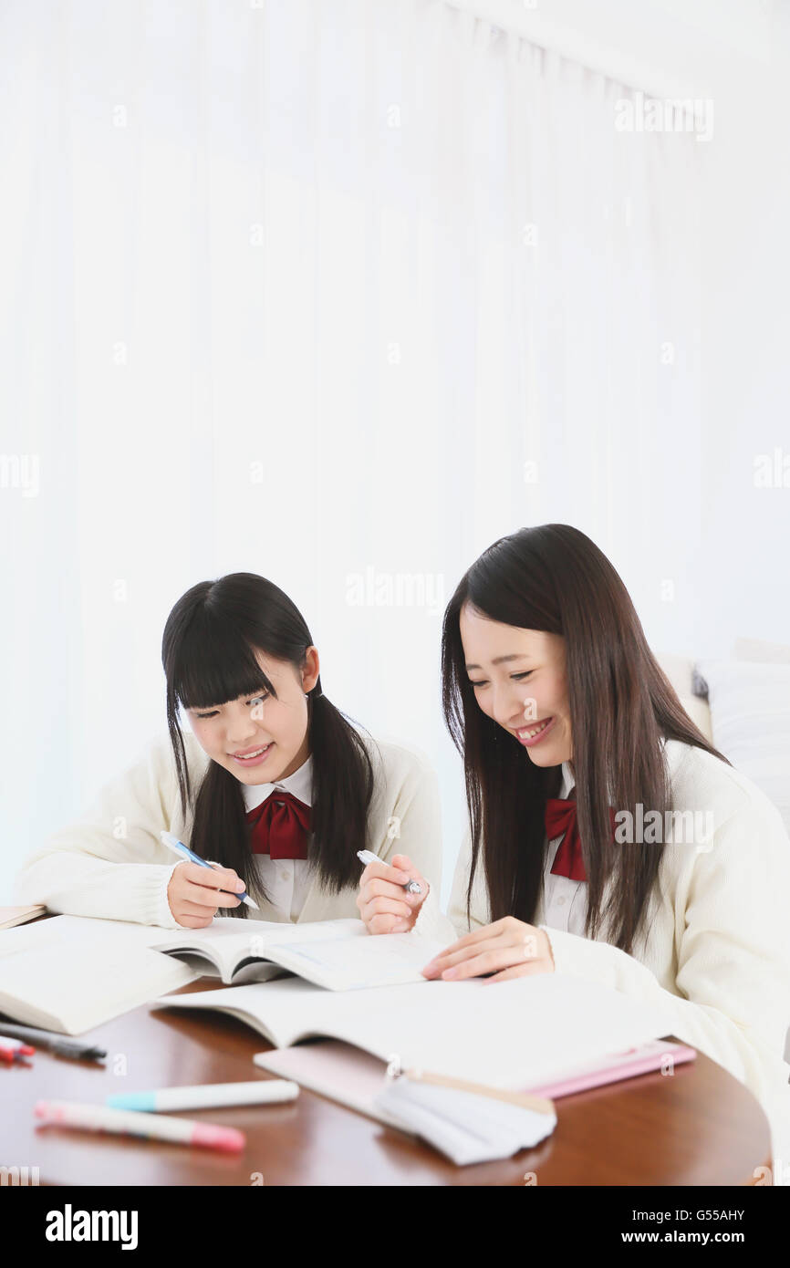 Japanese High-school students in uniform studying together Stock Photo ...