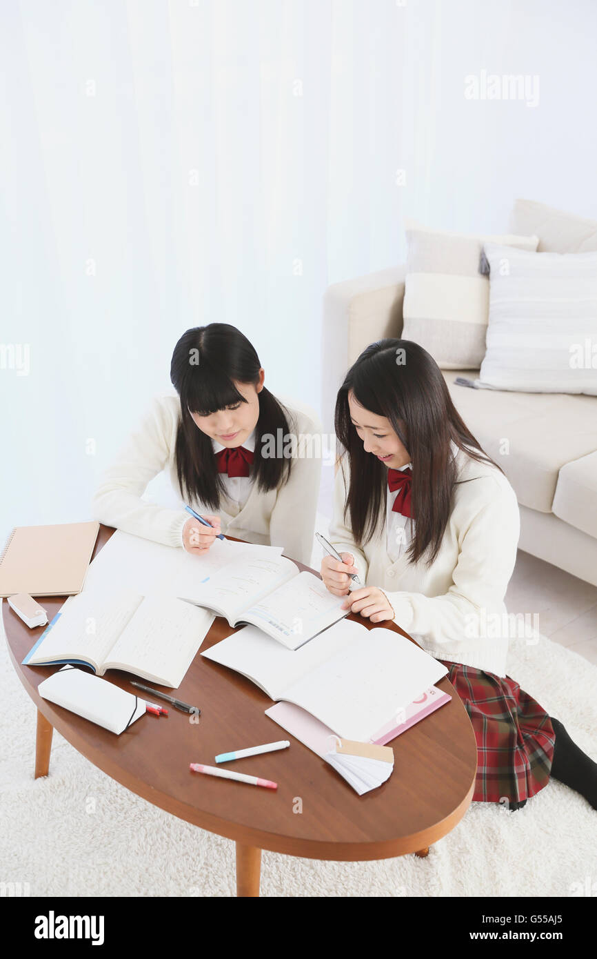 Japanese High-school students in uniform studying together Stock Photo ...