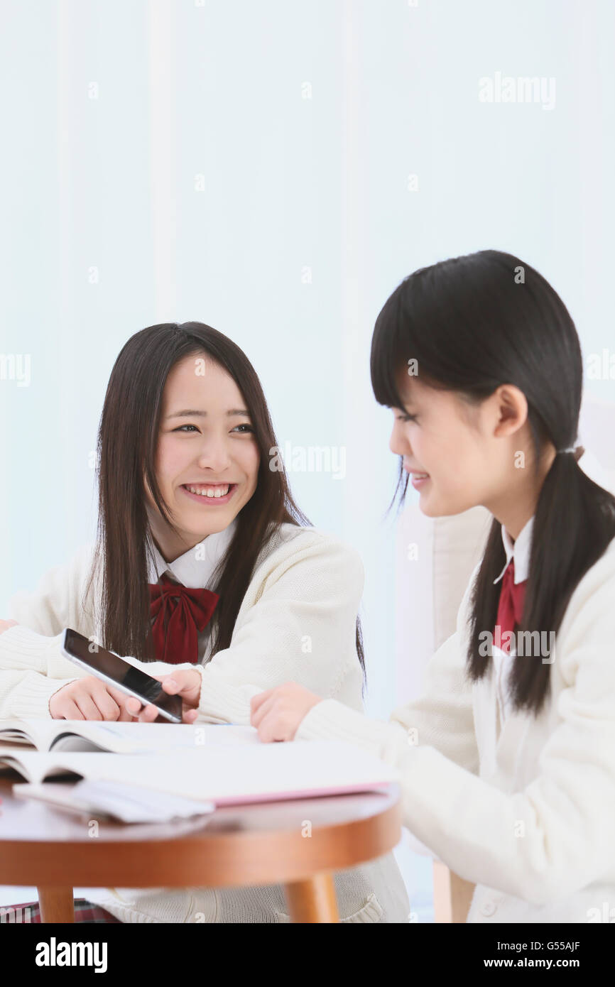 Japanese High-school students in uniform studying together Stock Photo ...