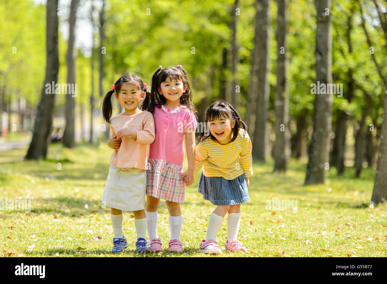 Kids playing in a park Stock Photo - Alamy