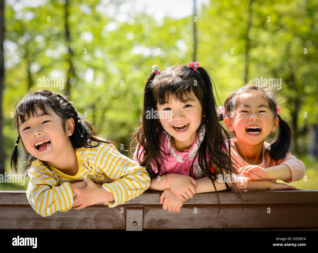 Kids playing in a park Stock Photo - Alamy