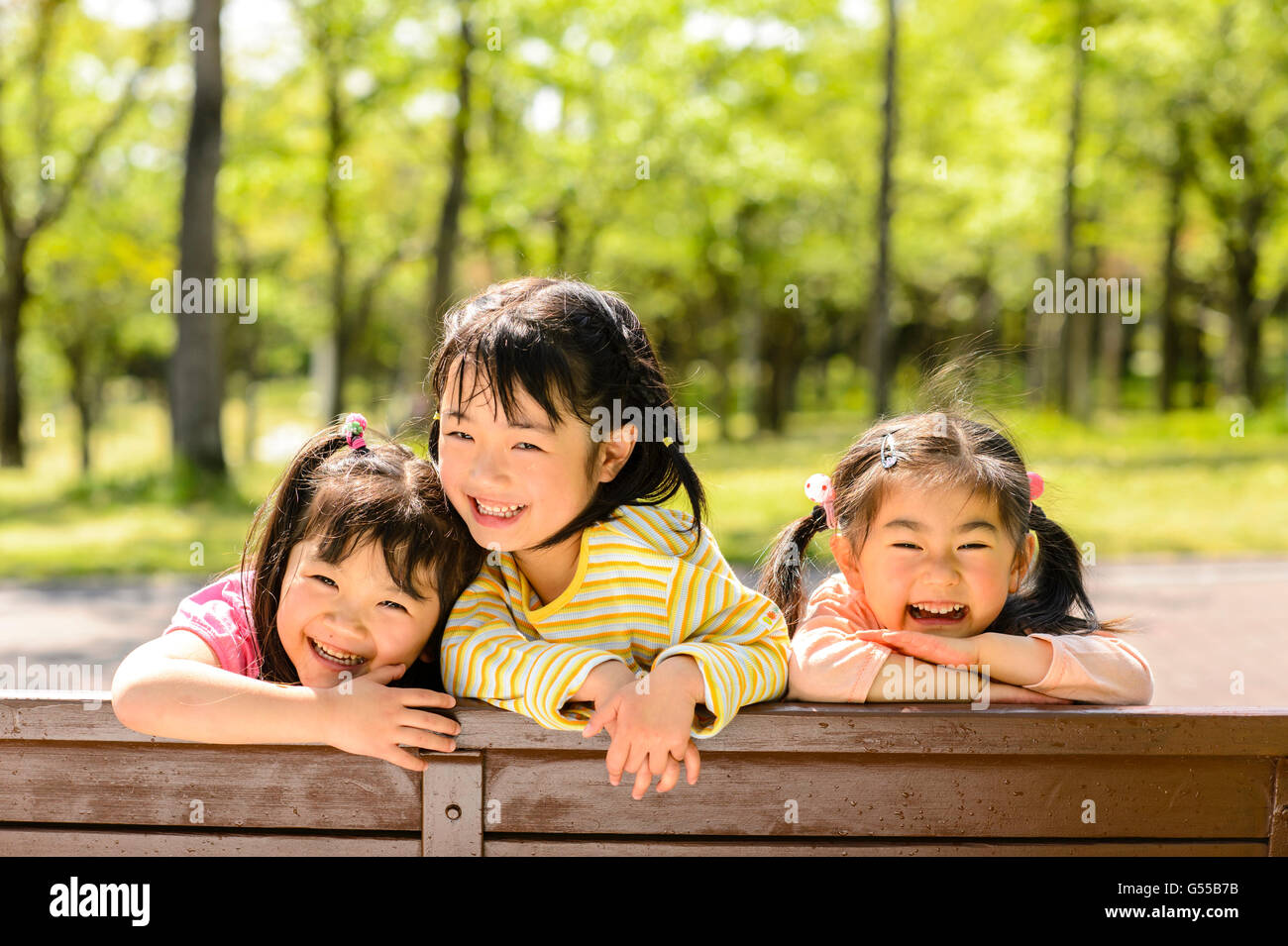 Kids playing in a park Stock Photo - Alamy