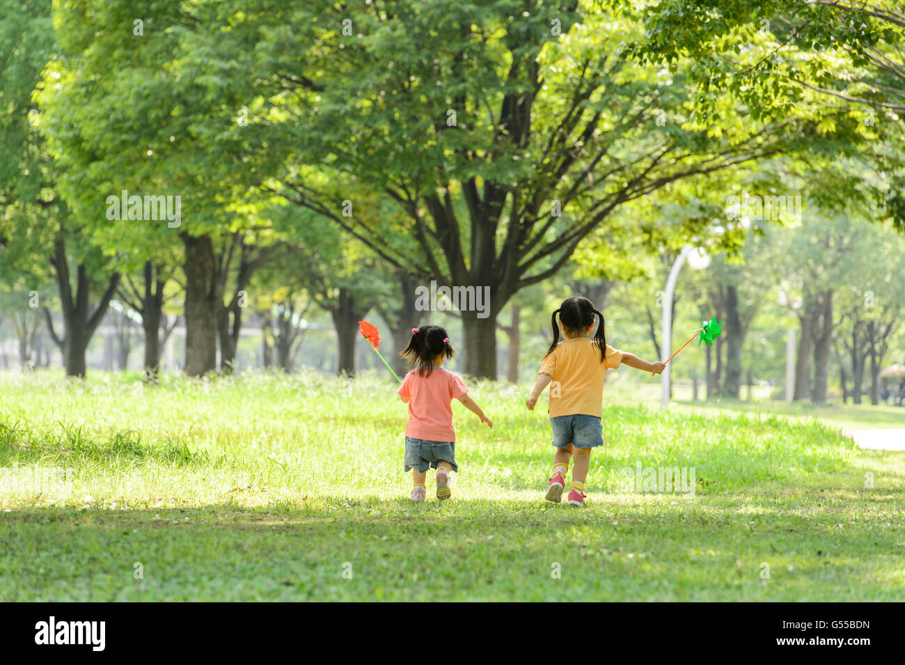 Kids playing in a park Stock Photo - Alamy