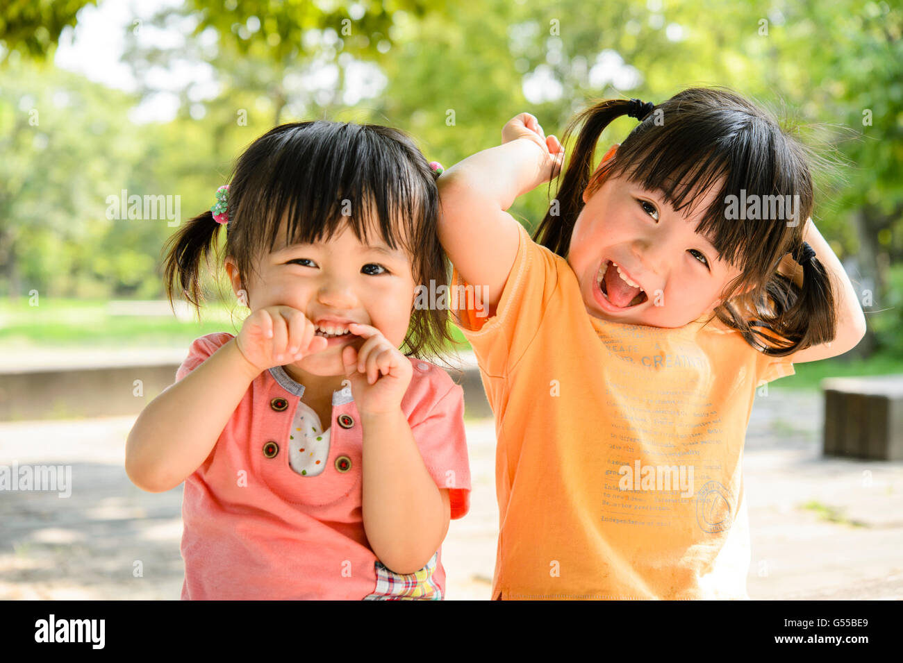 Kids playing in a park Stock Photo - Alamy