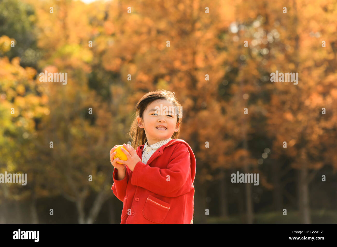 Children playing with yellow ball hi-res stock photography and images ...