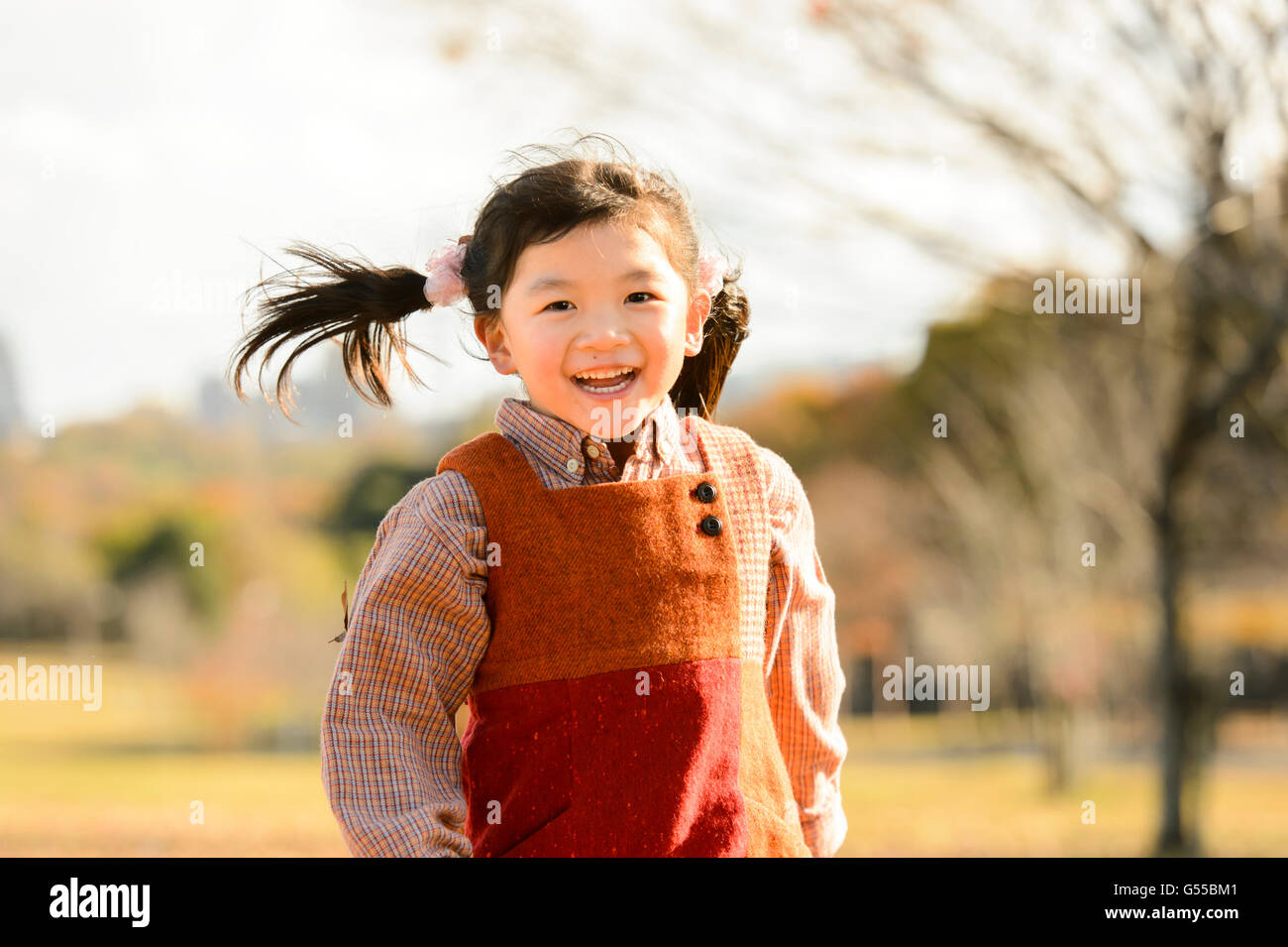 Kids playing in a park Stock Photo - Alamy