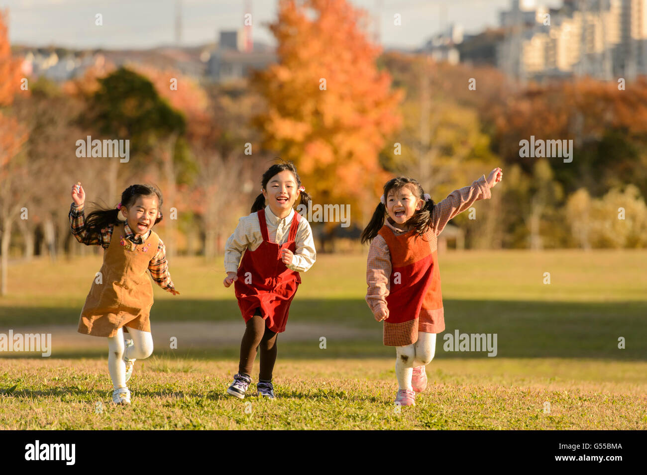 Kids playing in a park Stock Photo - Alamy