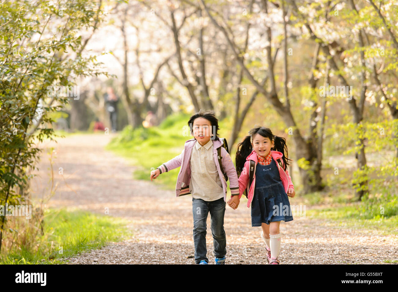 Kids playing in a park Stock Photo - Alamy