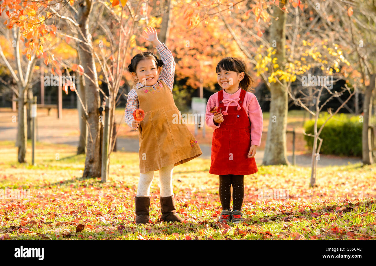 Kids playing in a park Stock Photo - Alamy