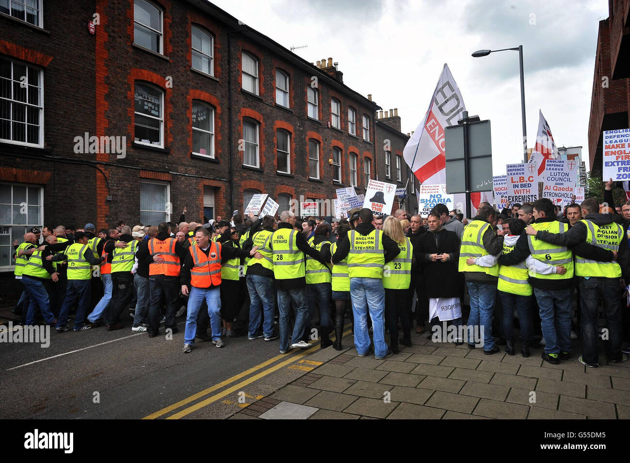 EDL supporters march in central Luton as a heavy police presence ...