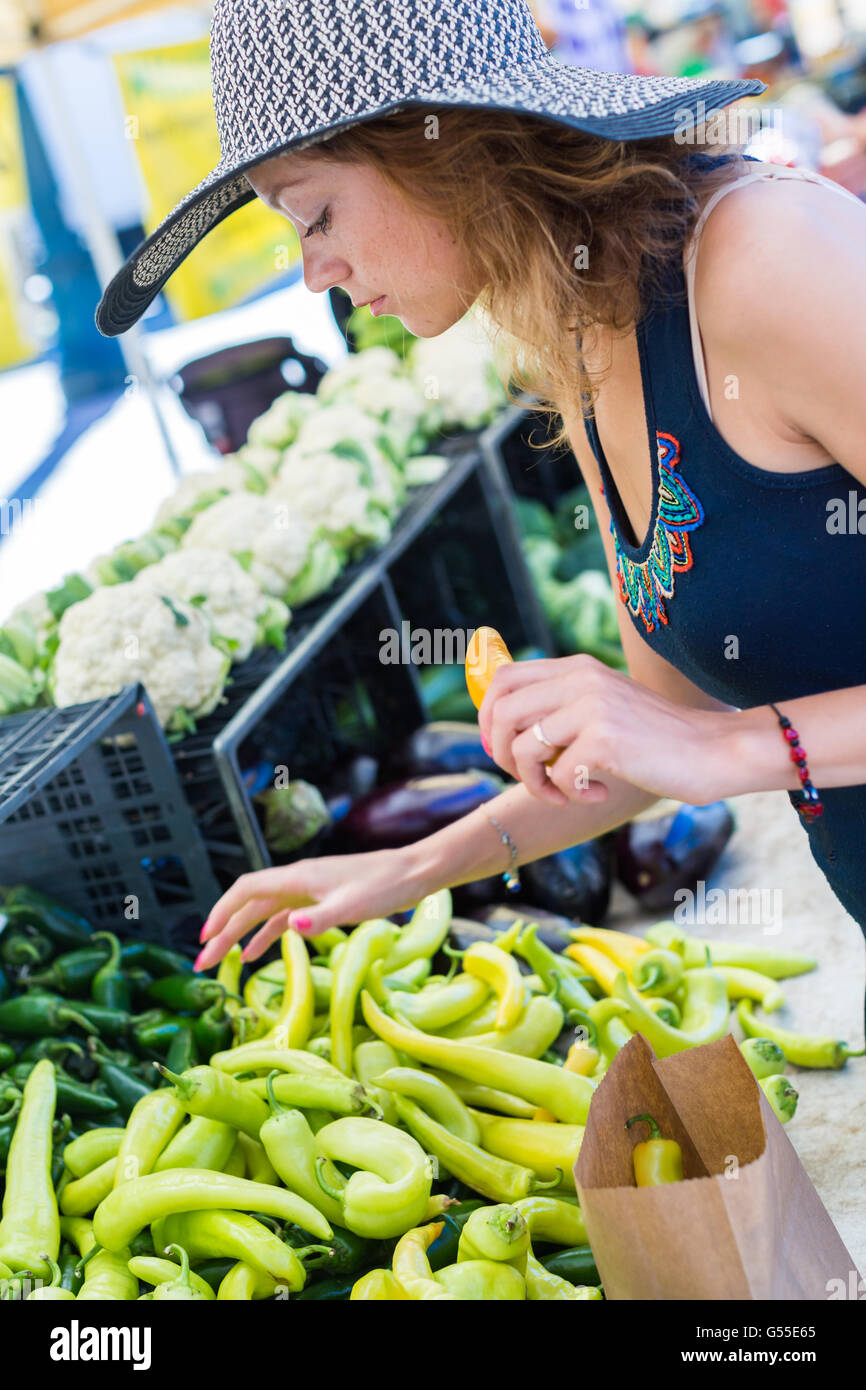 Young woman shopping at the local Farmers market Stock Photo - Alamy