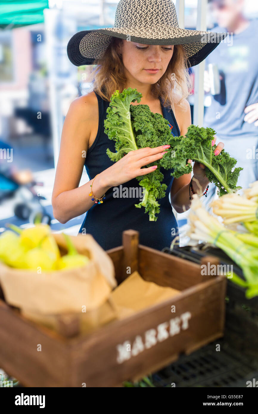 Young woman shopping at the local Farmers market Stock Photo - Alamy