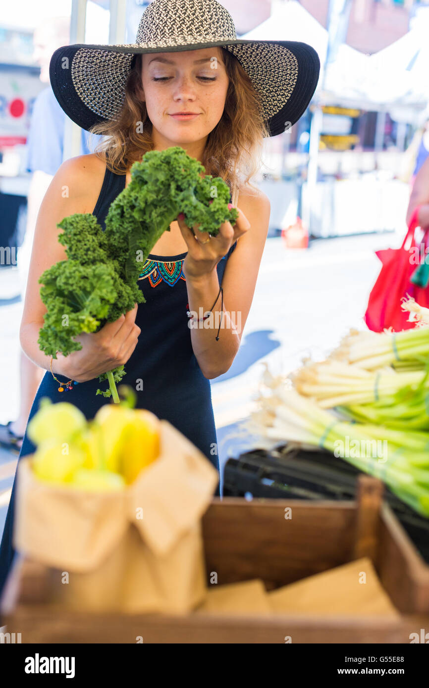 Young woman shopping at the local Farmers market Stock Photo - Alamy