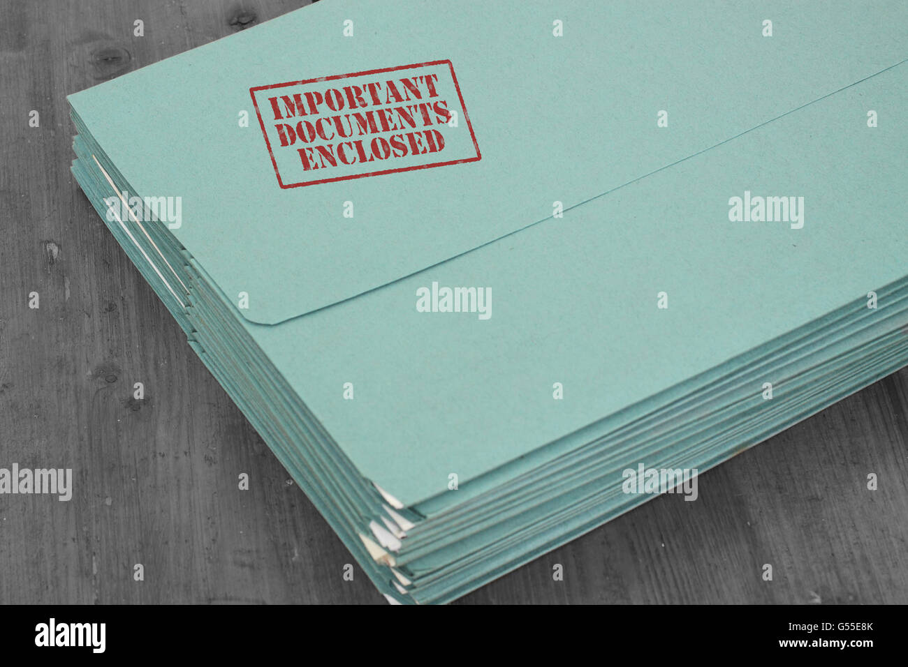 Folder with important documents enclosed stamped in red Stock Photo - Alamy