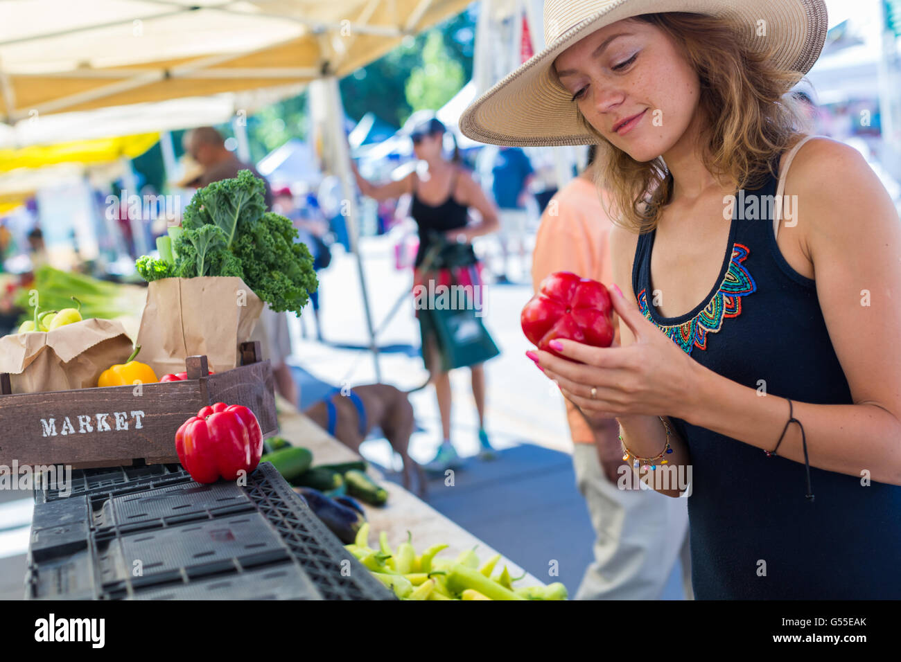 Young woman shopping at the local Farmers market Stock Photo - Alamy