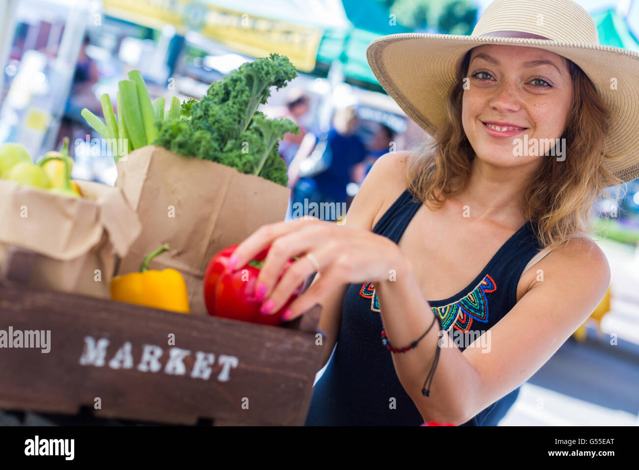 Young woman shopping at the local Farmers market Stock Photo - Alamy