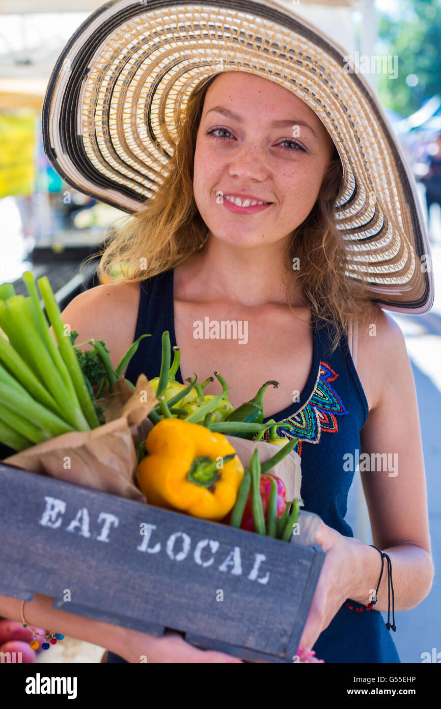Young woman shopping at the local Farmers market Stock Photo - Alamy