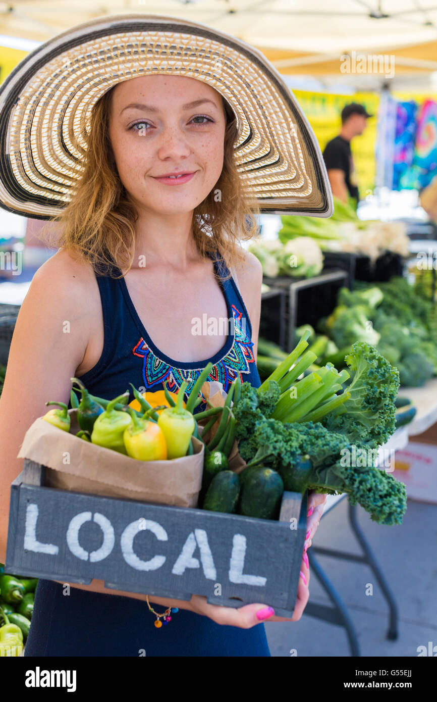 Young woman shopping at the local Farmers market Stock Photo - Alamy