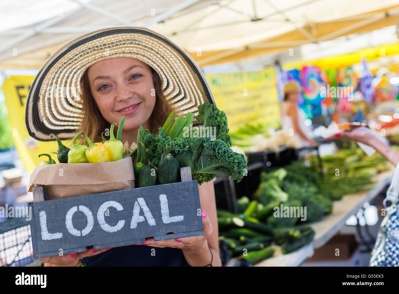 Young woman shopping at the local Farmers market Stock Photo - Alamy