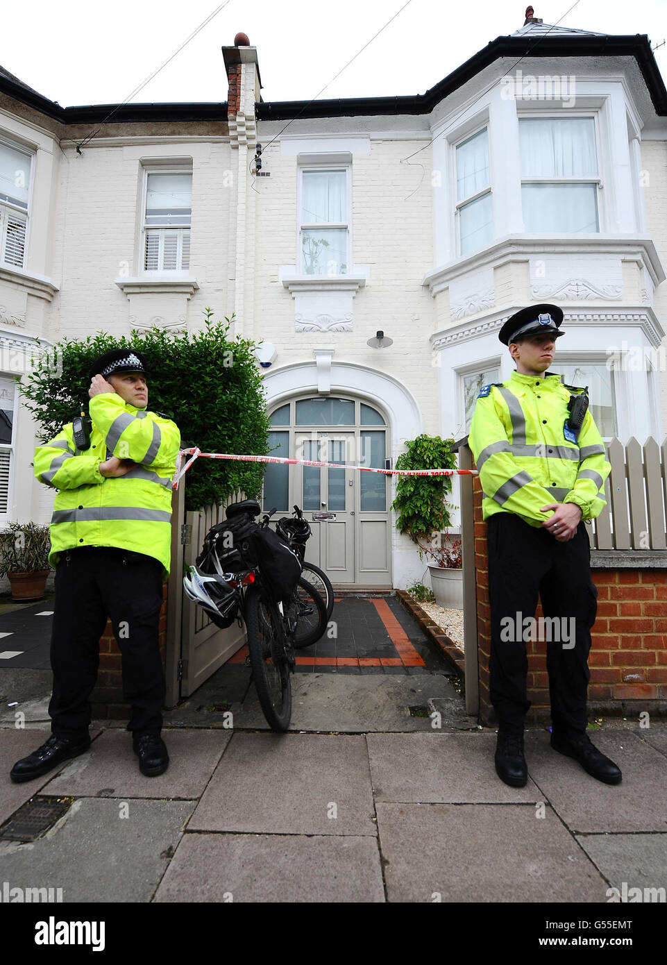 Police officers stand outside a house in wandsworth hi-res stock ...