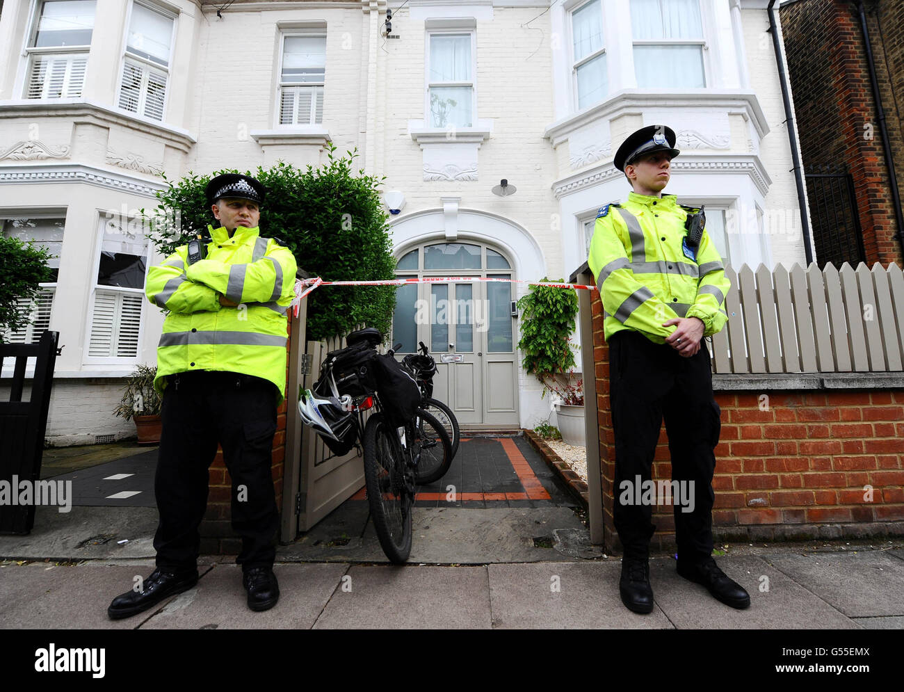 Police officers stand outside a house in wandsworth hi-res stock ...