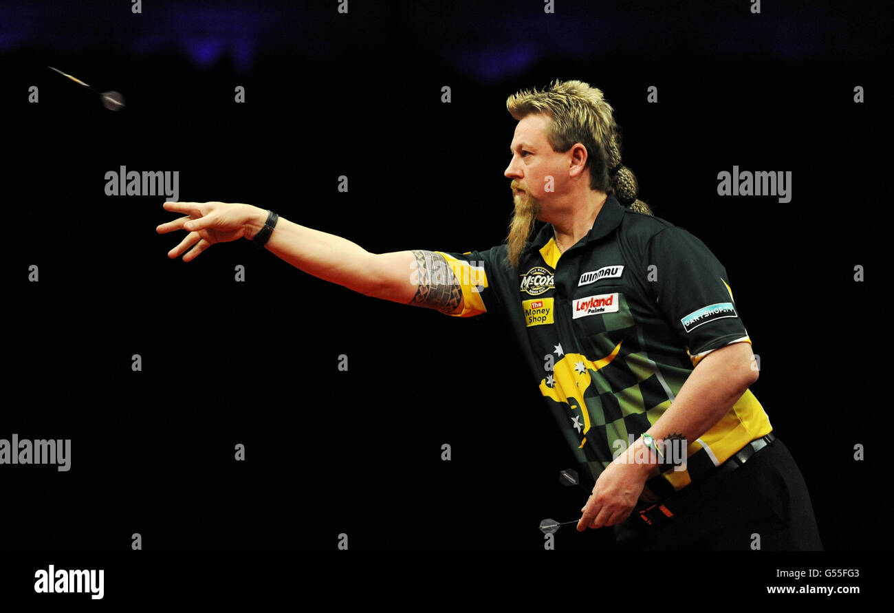 Simon Whitlock in action during his match with Adrian Lewis during the ...