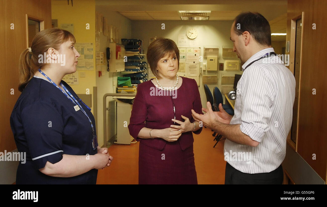 Health Secretary Nicola Sturgeon with Doctor Ewan Forrest (right) and ...