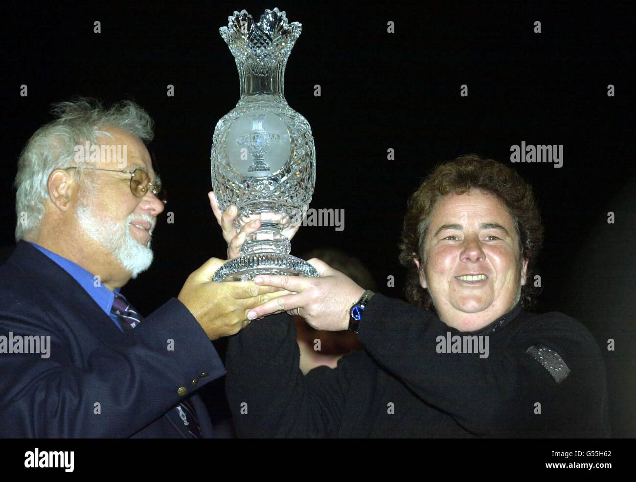 European Captain Dale Reid is presented with the cup by John Solheim ...