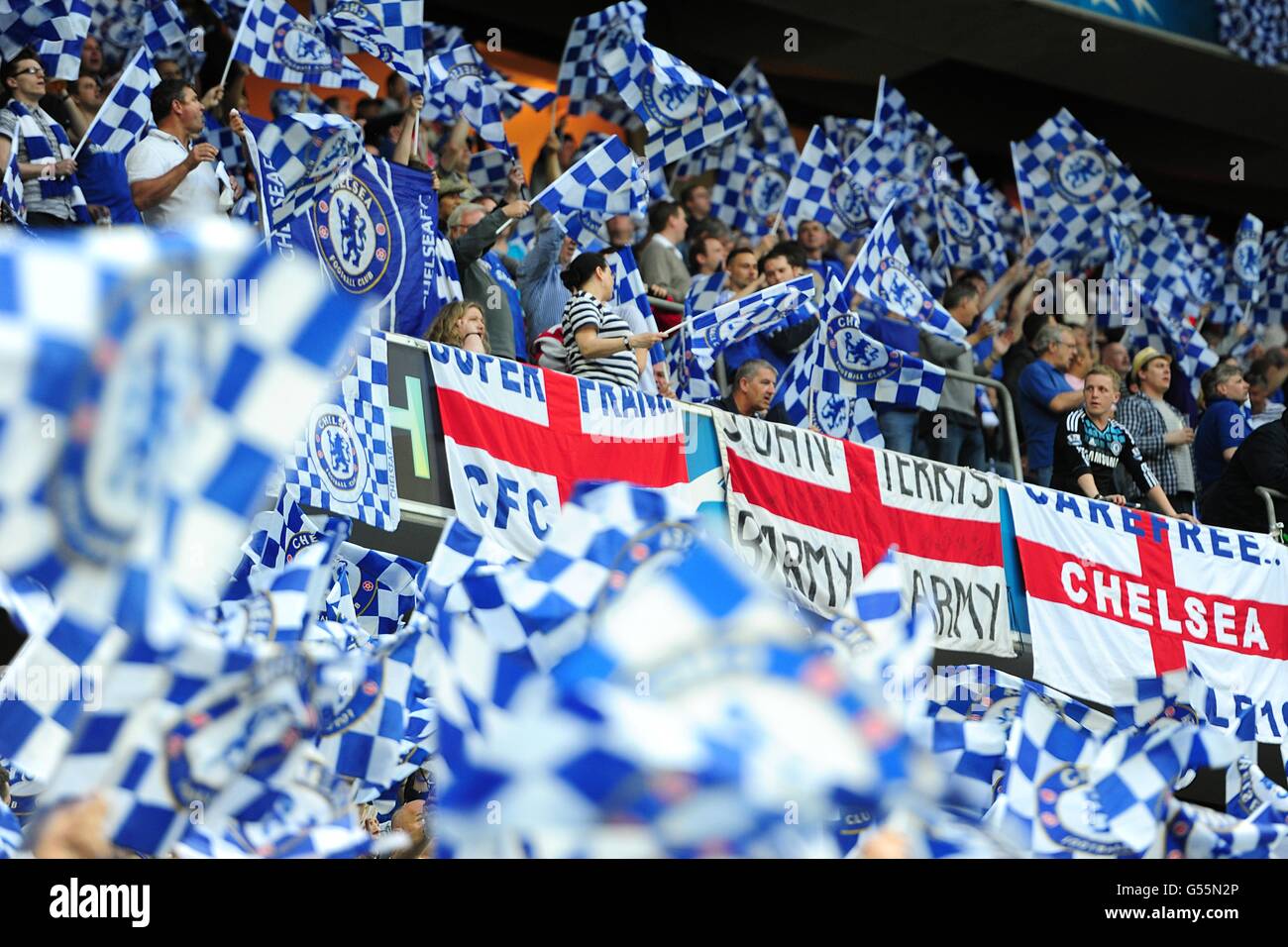 Chelsea fans in the stands wave flags hi-res stock photography and ...