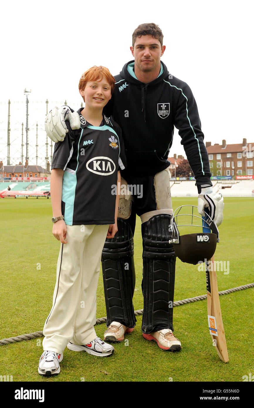 Surrey Lions' Tom Maynard with the Surrey matchday mascot Stock Photo ...