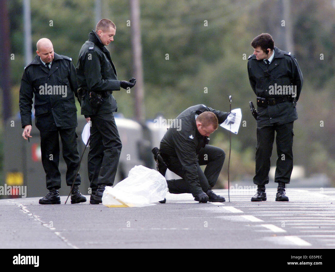 Police officers examine the front of Castlewellan Royal Ulster ...