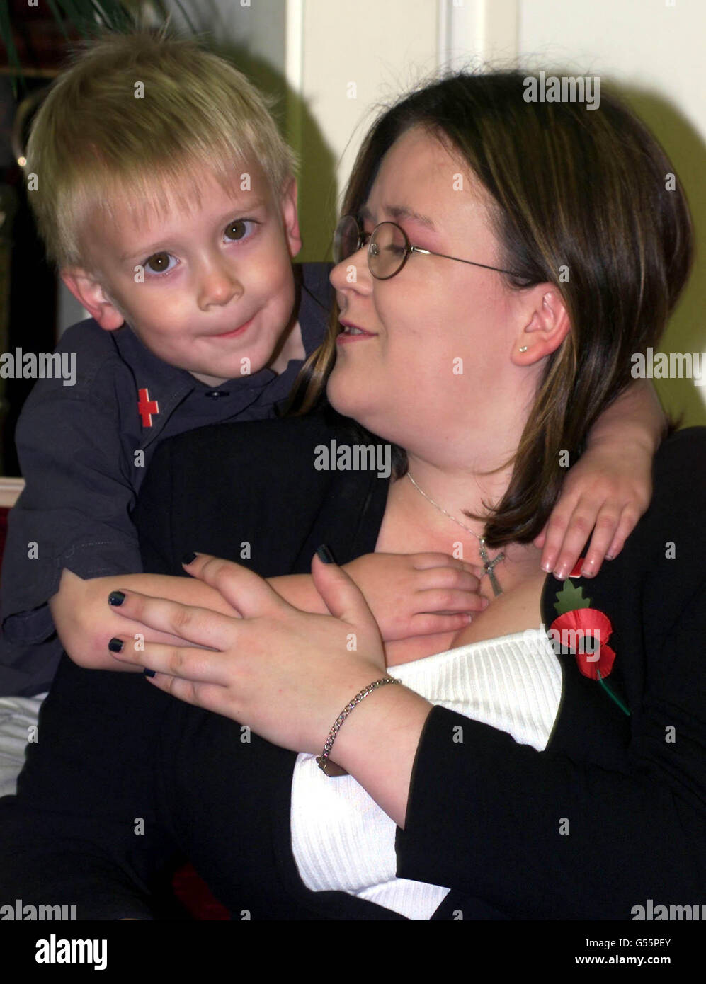 Humanitarian award red cross badge mother and son hi-res stock ...