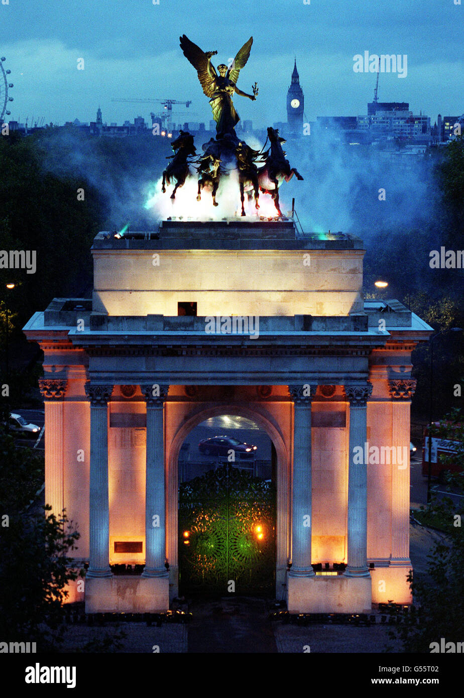 Smoke hovers over the newly restored Wellington Arch in Hyde Hark ...