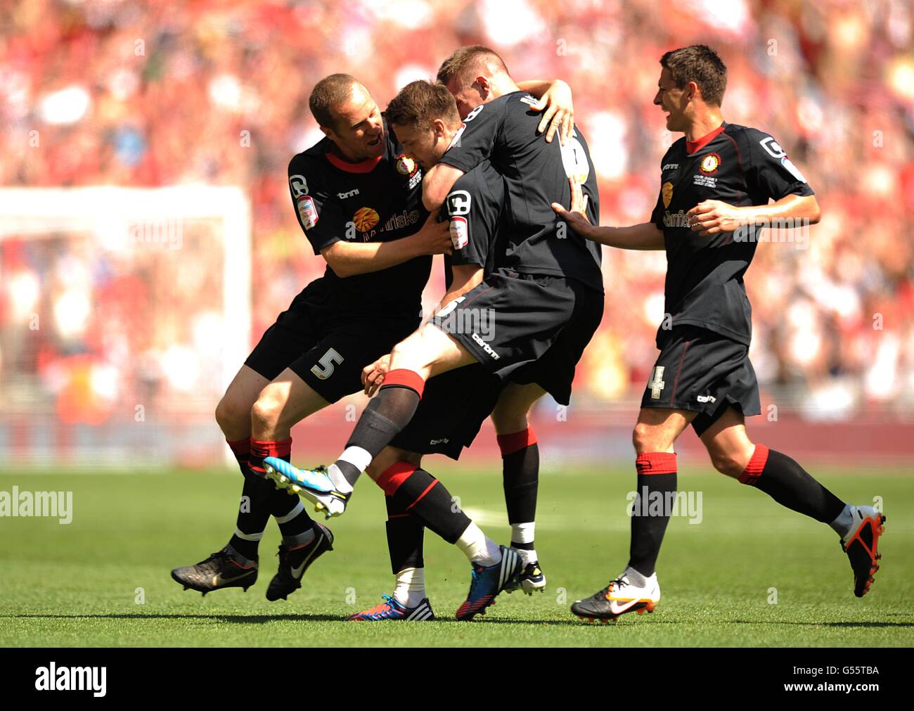 Crewe Alexandra's Nick Powell (centre) celebrates with his team-mates ...