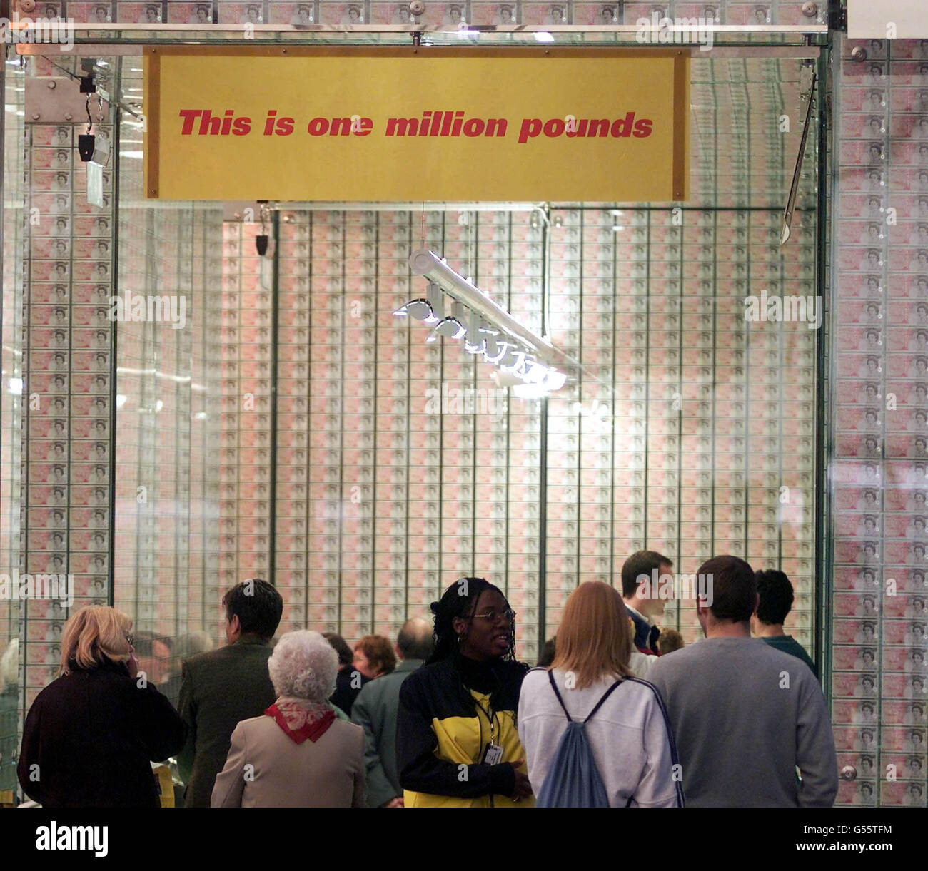 Visitors to the Millennium Dome's Money Zone where there are twenty ...