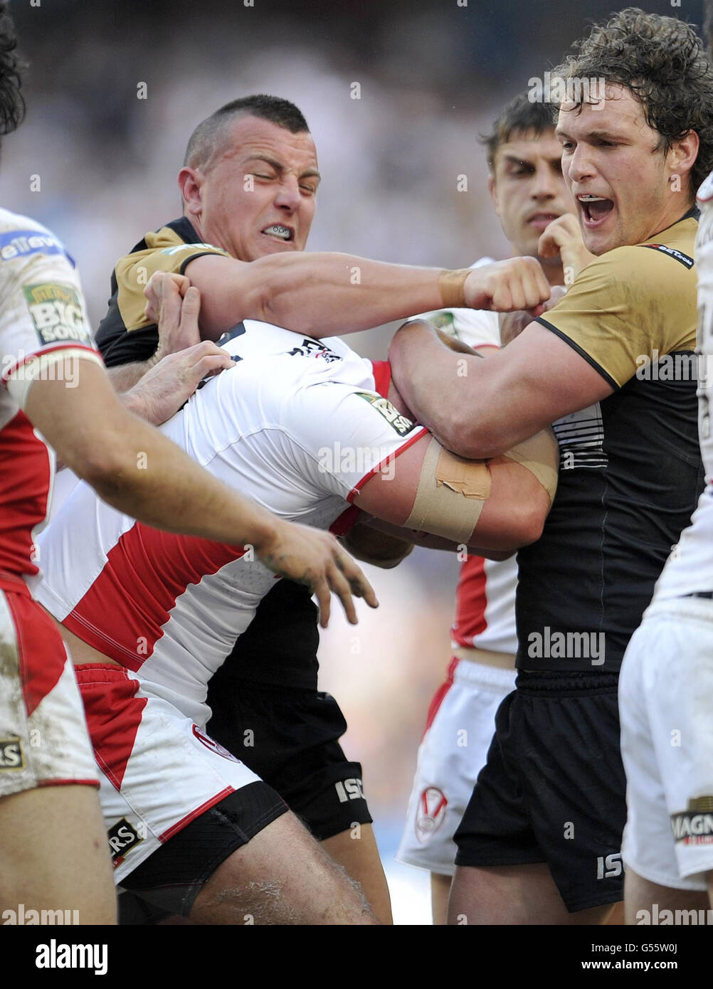 Wigan Warriors's Chris Tuson (left) throws a bunch at St Helens's Shaun ...