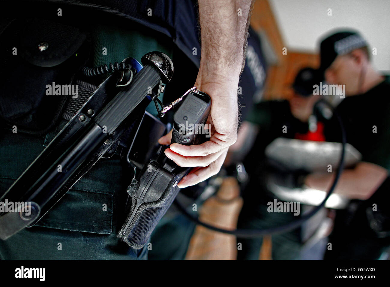 PSNI Organised Crime Branch officers prepare to enter an apartment in ...